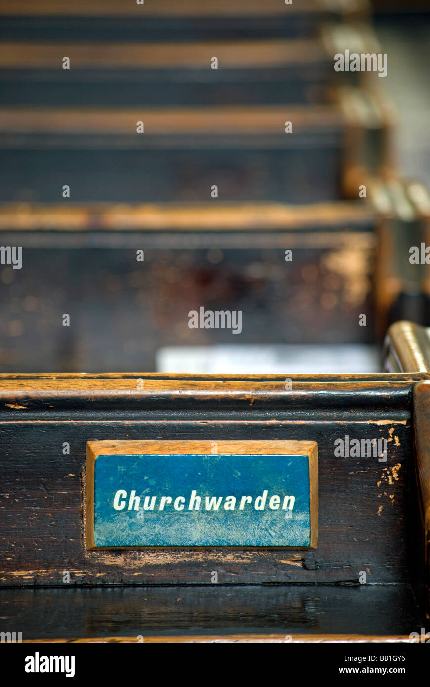 sign on back of british church pew showing space reserved for ...