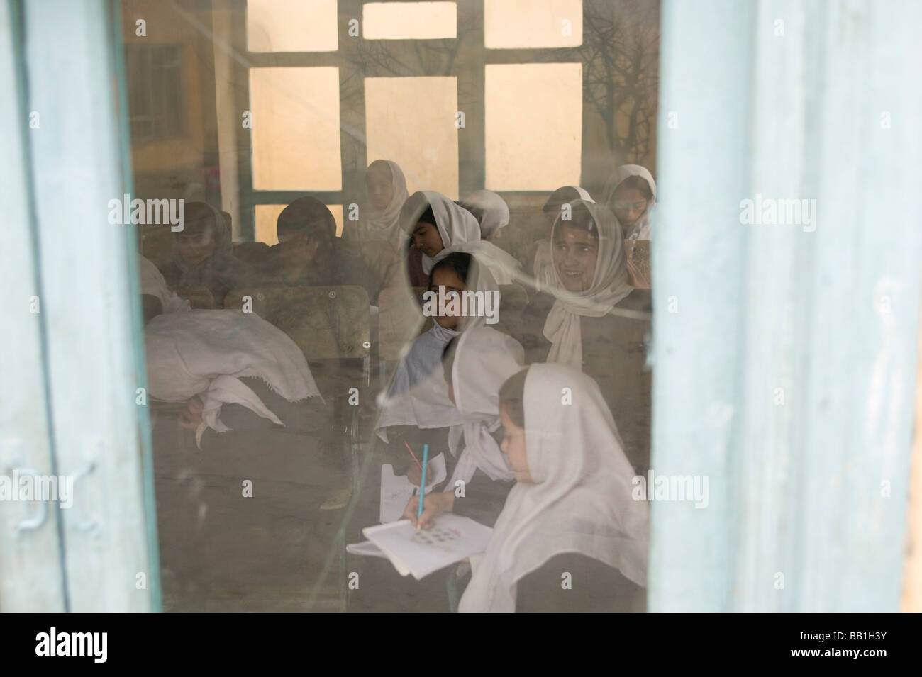 View of classroom through broken glass, Out of School girls project ...