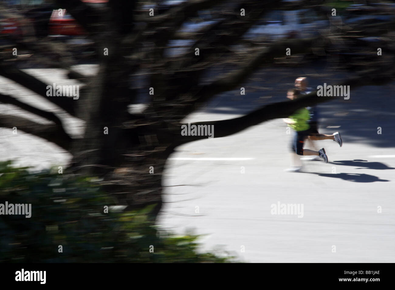 two fast runners in street in city town Stock Photo - Alamy