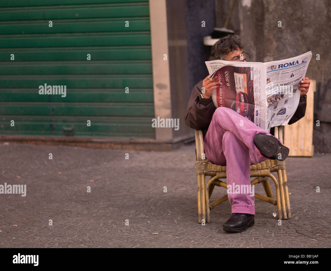 Man reading newspaper; Naples, Italy Stock Photo - Alamy