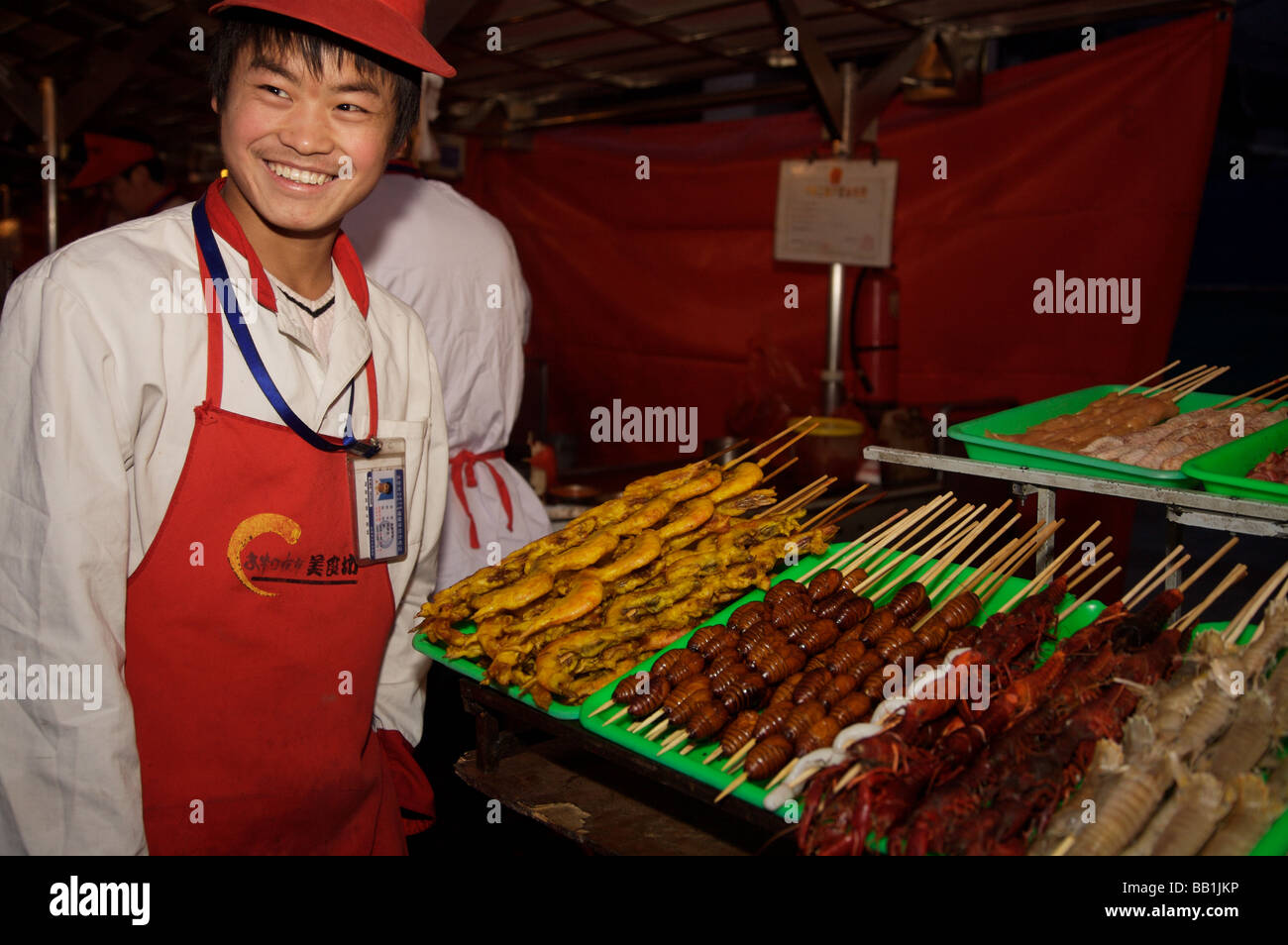 Man selling food on a stick at the night market in Beijing Stock Photo ...