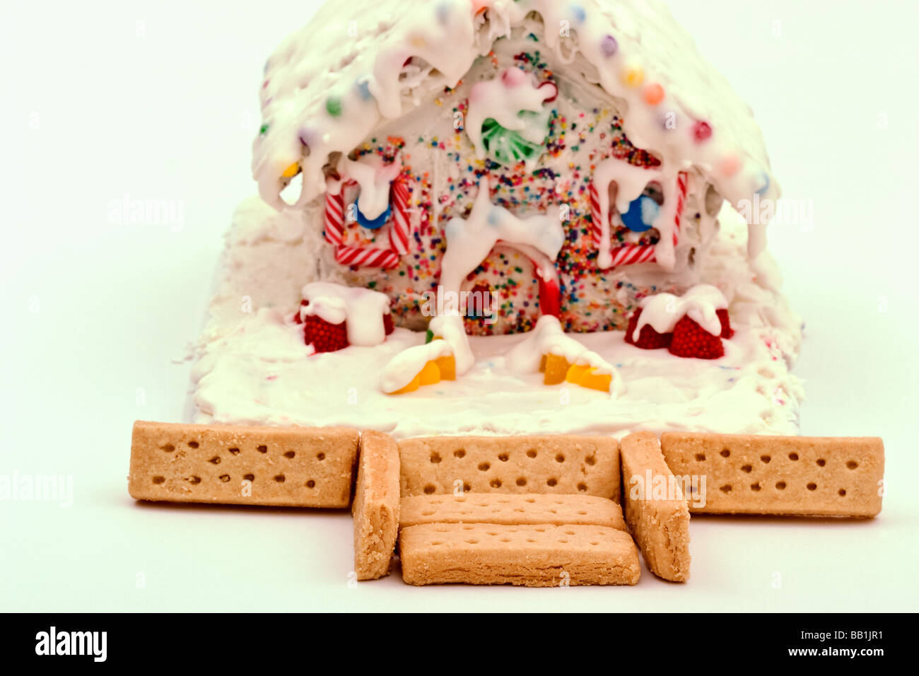 Gingerbread house decorated with icing and candy with shortbread ...