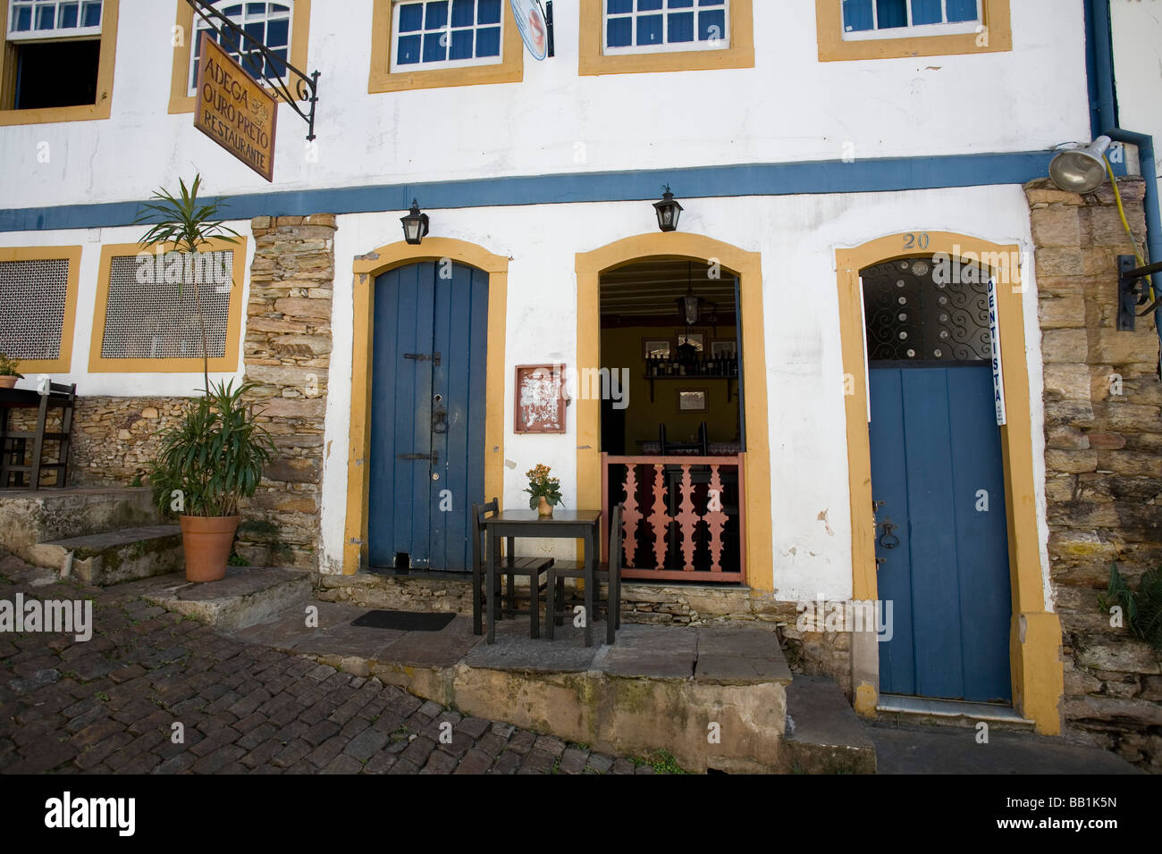 Colorful colonial buildings and narrow cobblestone streets of Ouro ...