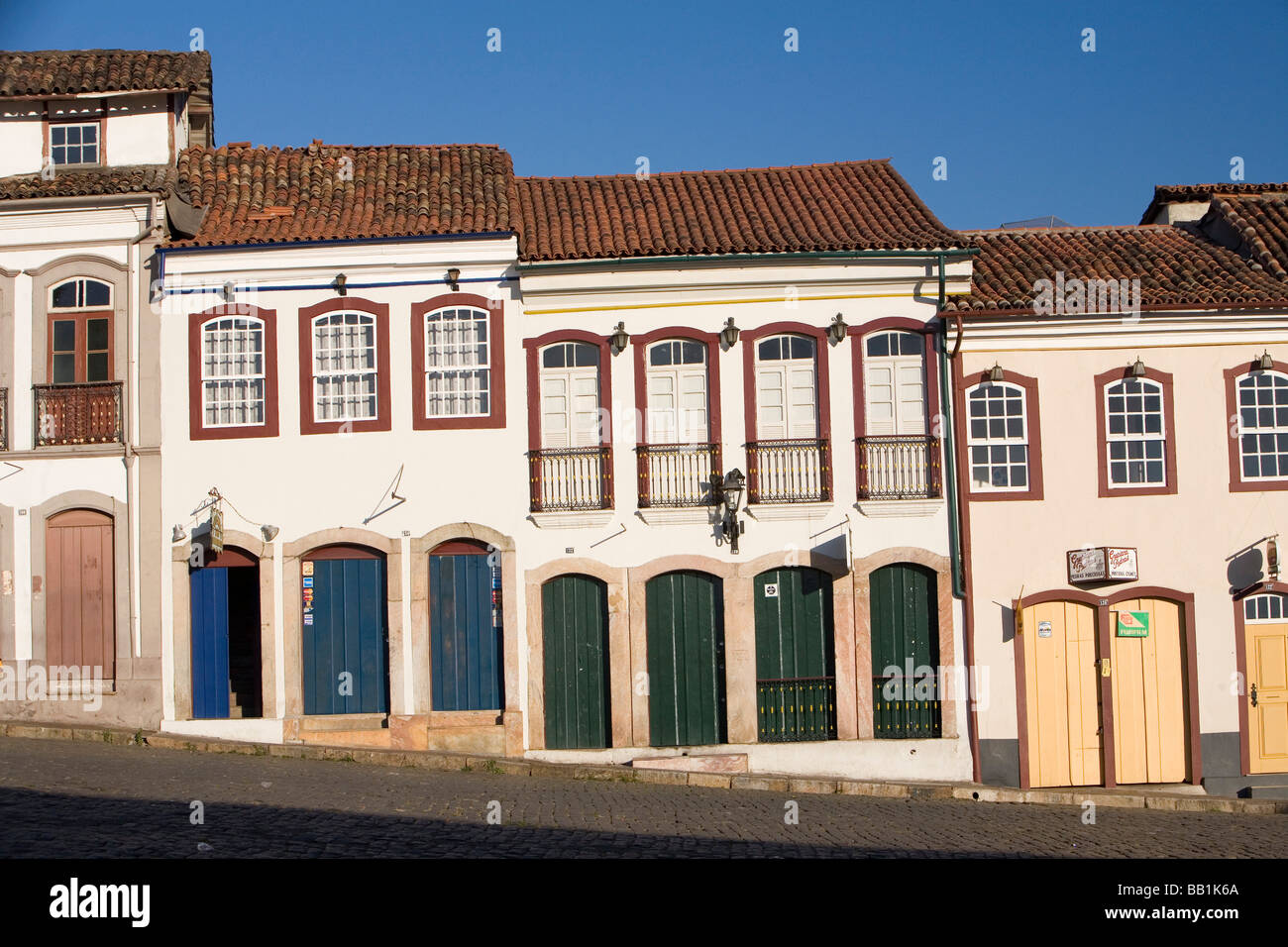 Colorful colonial buildings and narrow cobblestone streets of Ouro ...