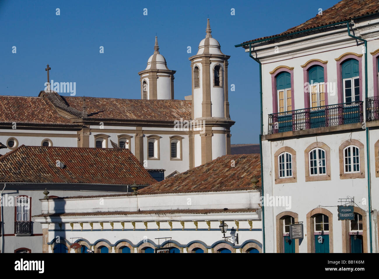 Colorful colonial buildings and narrow cobblestone streets of Ouro ...