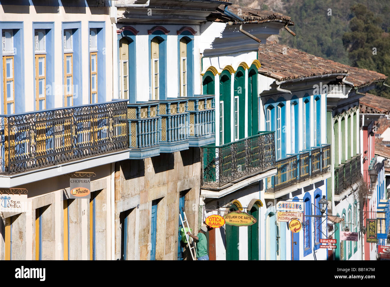 Colorful colonial buildings and narrow cobblestone streets of Ouro ...