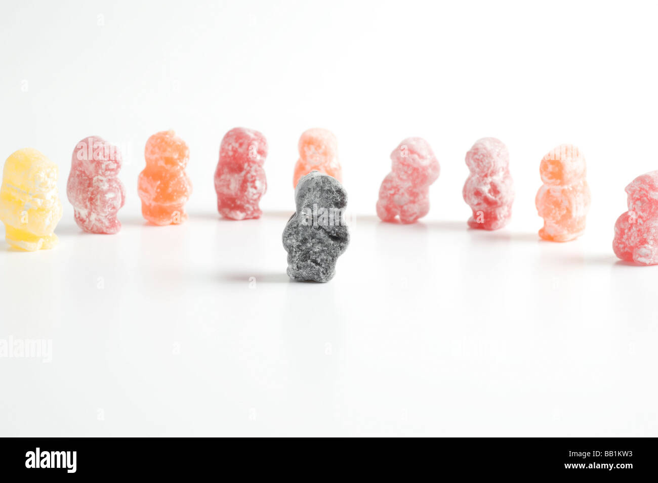 Gang of Jelly Babies picking on one other Jelly Baby Stock Photo - Alamy