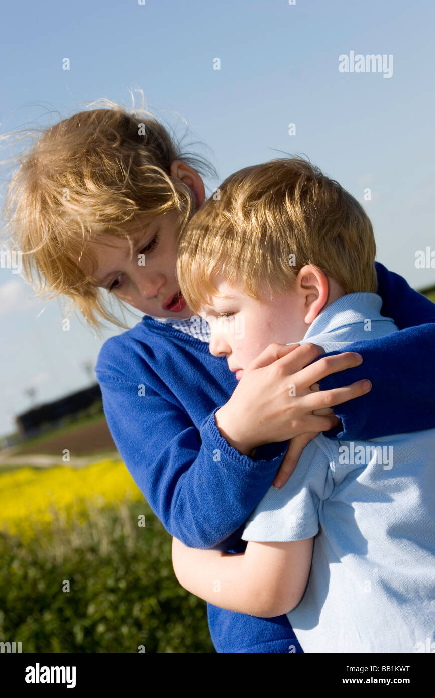 brother and sister hugging Stock Photo - Alamy
