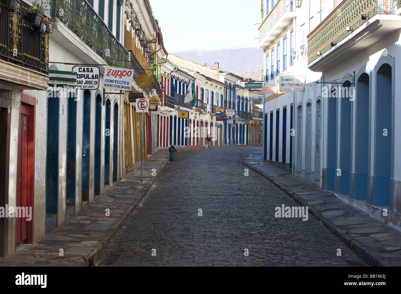 Colorful colonial buildings and narrow cobblestone streets of Ouro ...