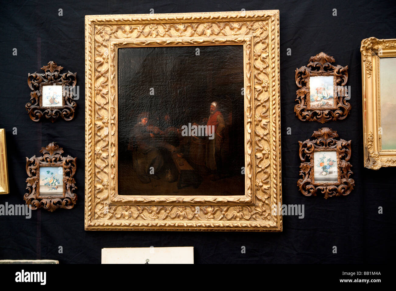 Antique dutch style painting with gold frame at the antique market ...