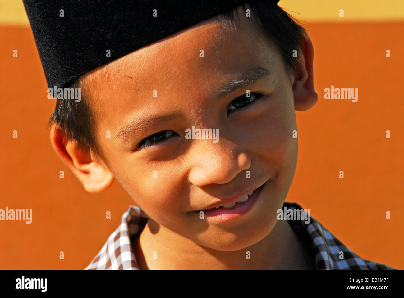 BRUNEI, Bandar Seri Begawan. Portrait of an asian muslim boy wearing a ...
