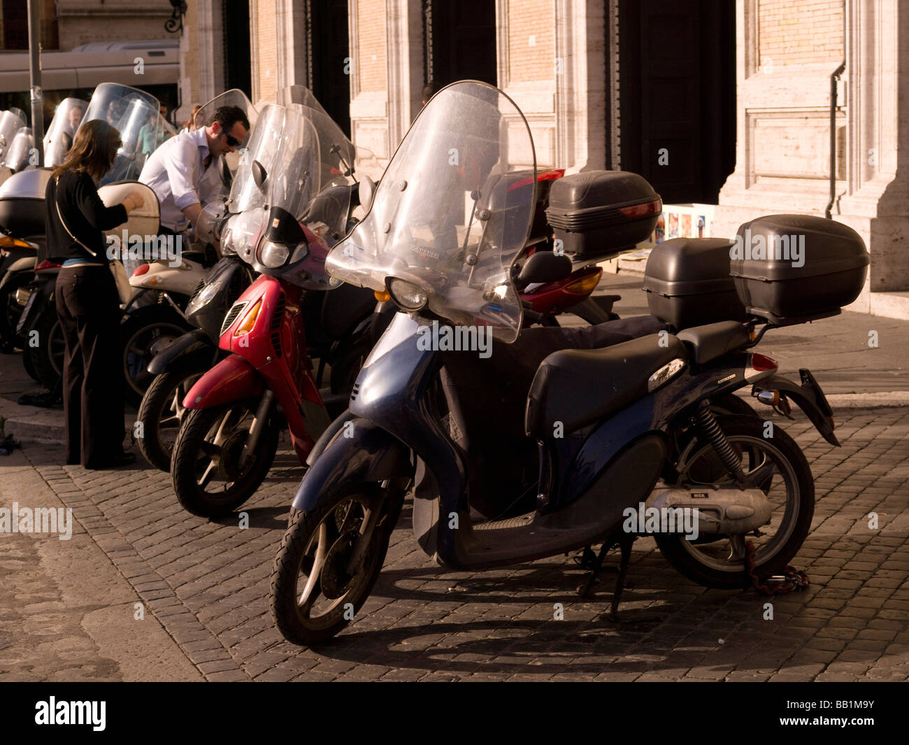 Motorcycles parked in front of old building; Rome, Italy Stock Photo ...