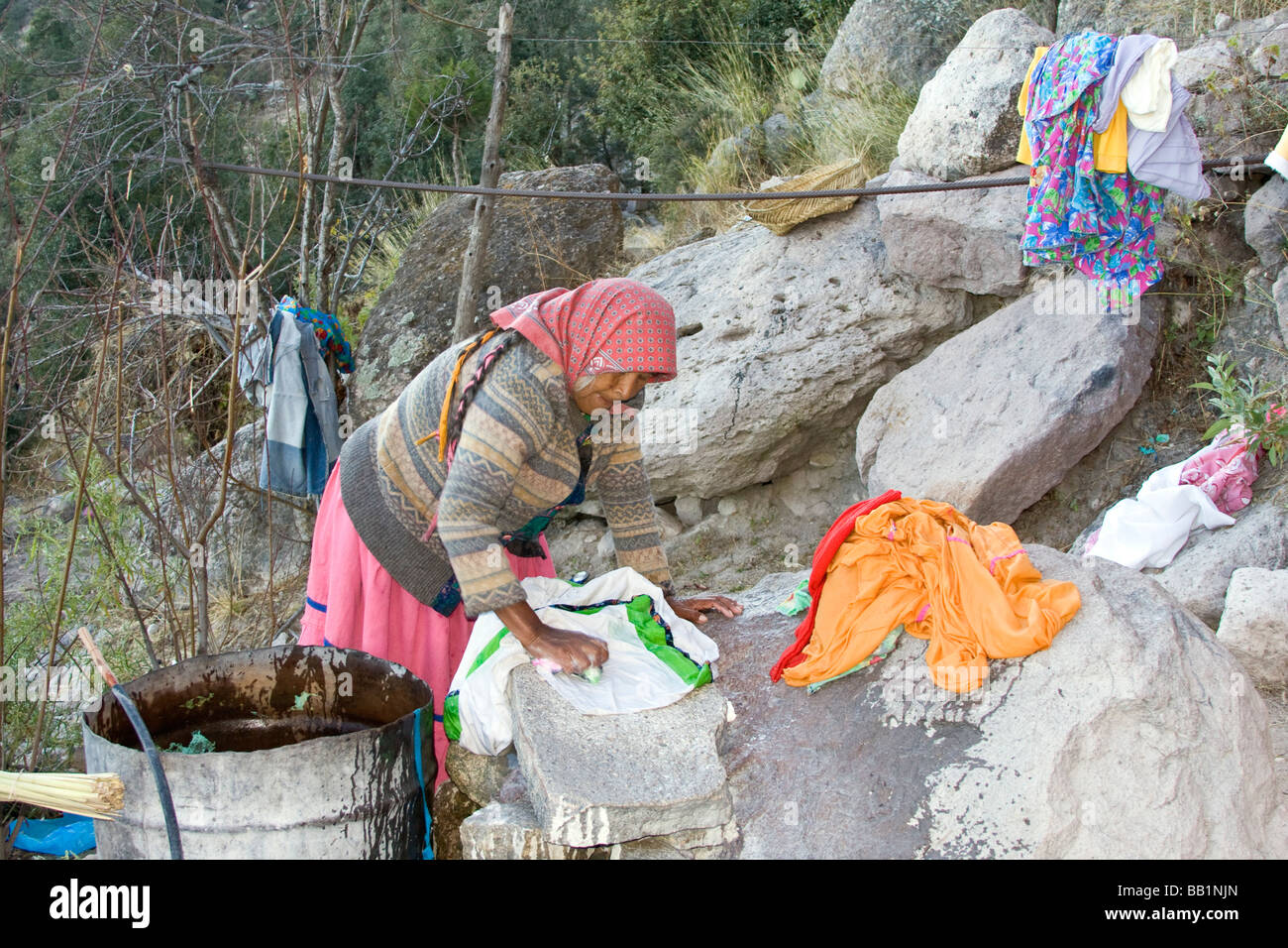 Indian woman washing clothes in hi-res stock photography and images - Alamy