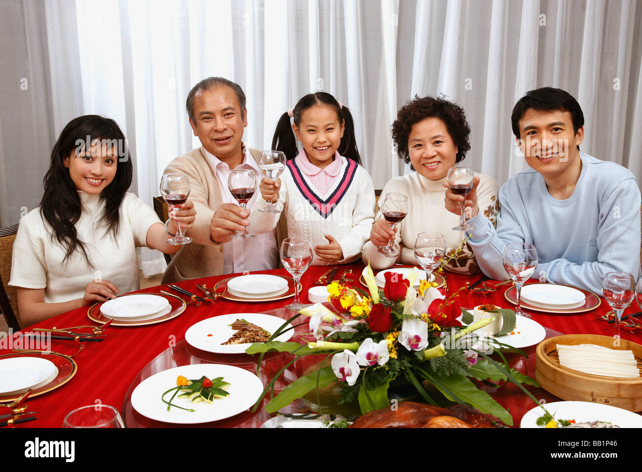 Chinese family dinner toasting together hi-res stock photography and ...