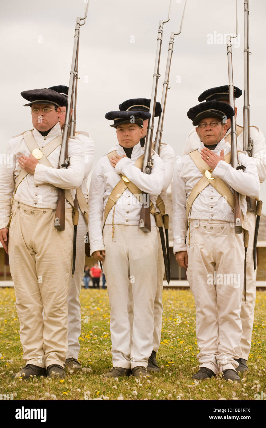 MEN IN PERIOD MILITARY UNIFORMS STAND AT ATTENTION WITH MUSKETS Stock ...