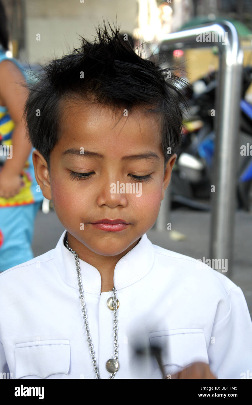 Young boy on the street in Bangkok Stock Photo - Alamy