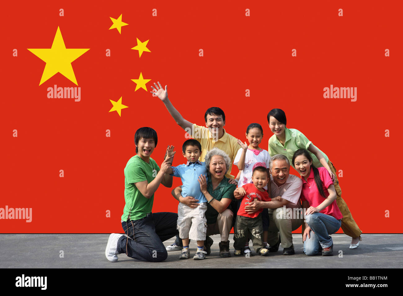 Chinese family getting together under the Chinese National flag Stock ...