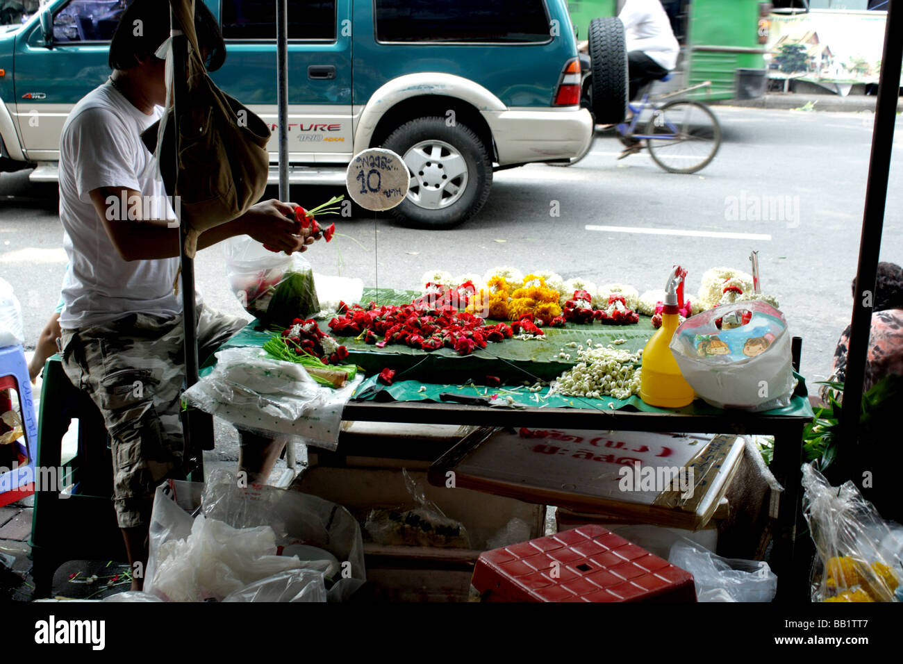 Thai merchant at Pak Khlong Talat Flower Market , Bangkok , Thailand ...