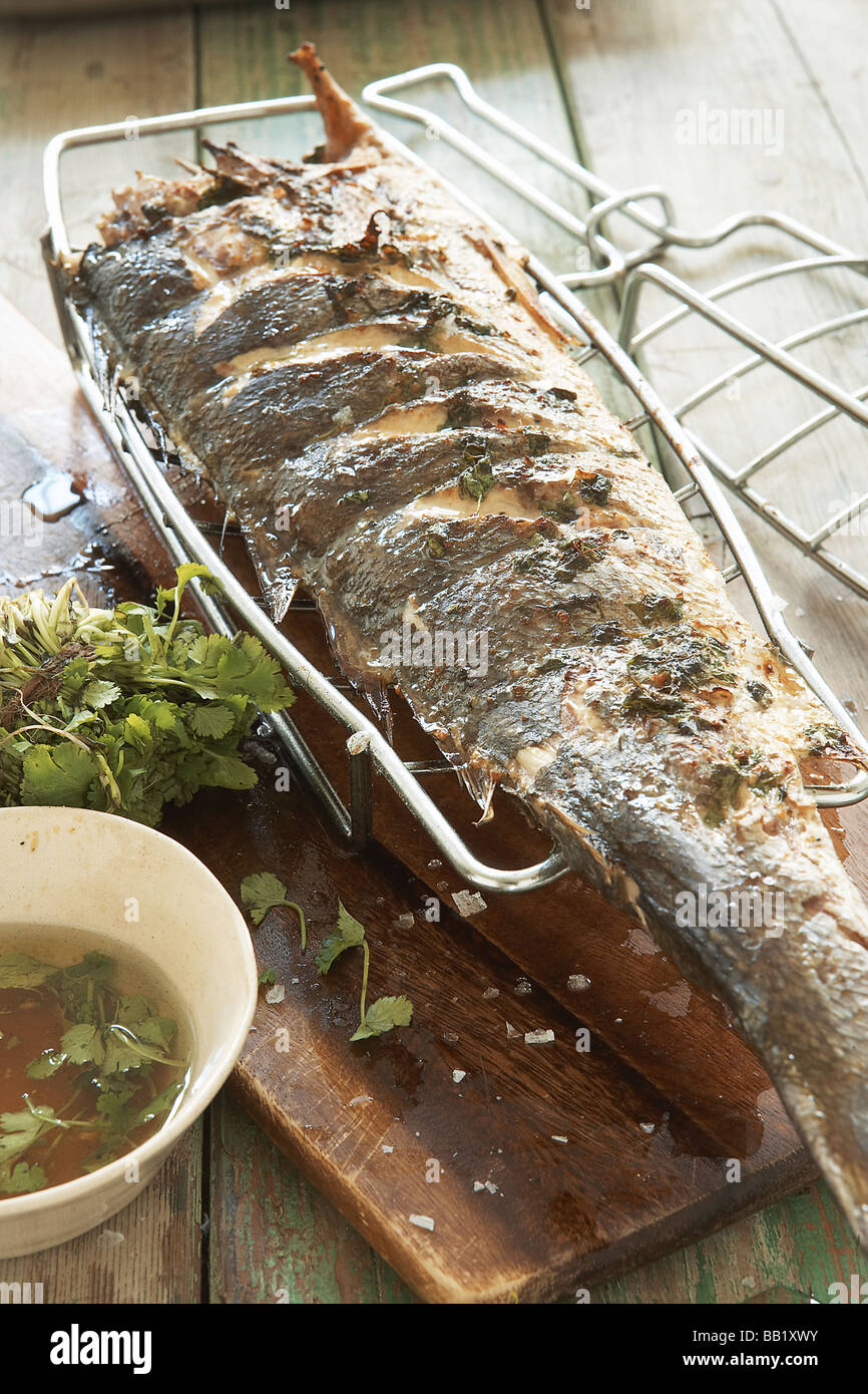 Whole braaied linefish with ginger and coriander, South Africa Stock ...