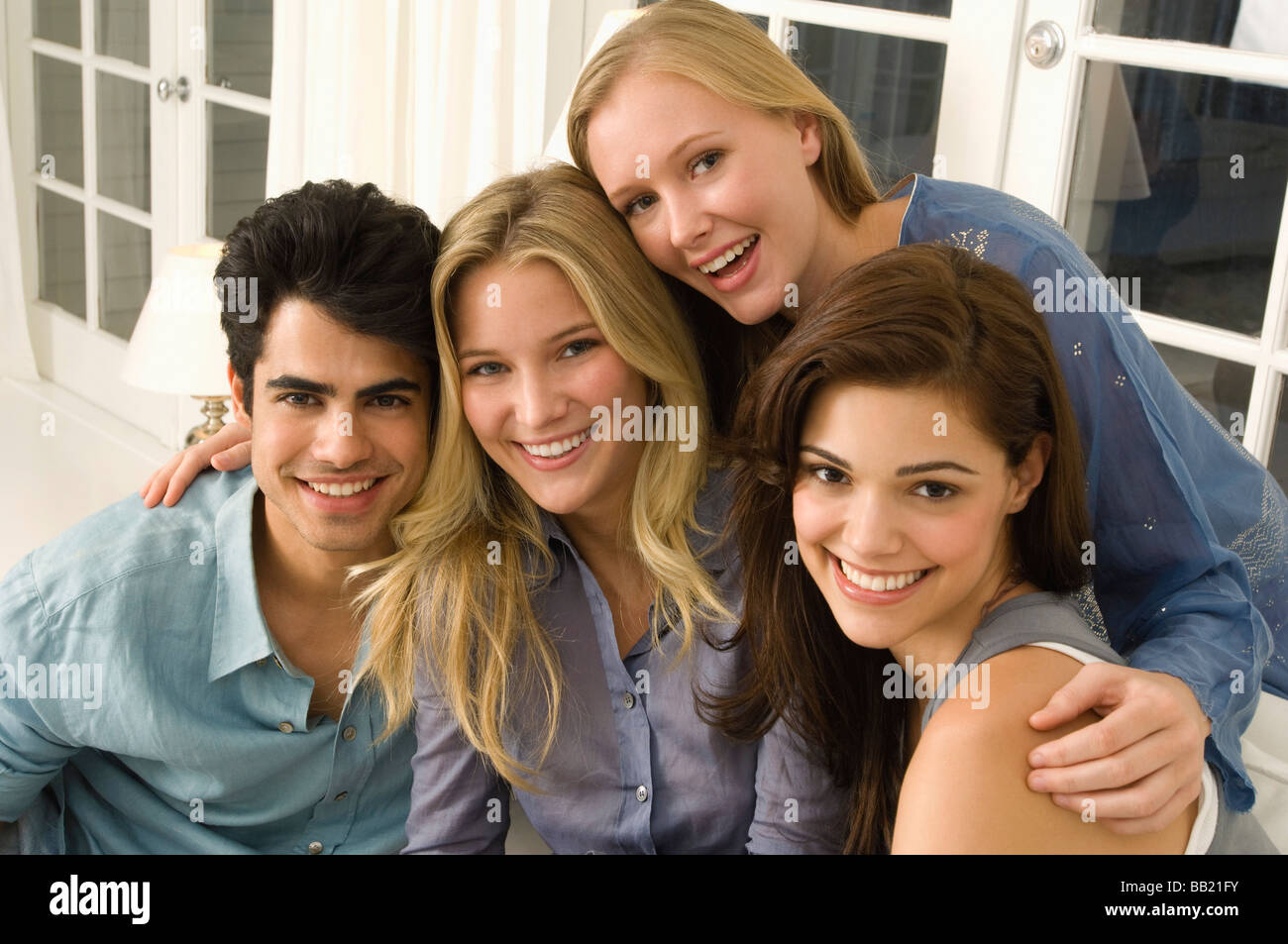 Portrait of four friends smiling Stock Photo - Alamy