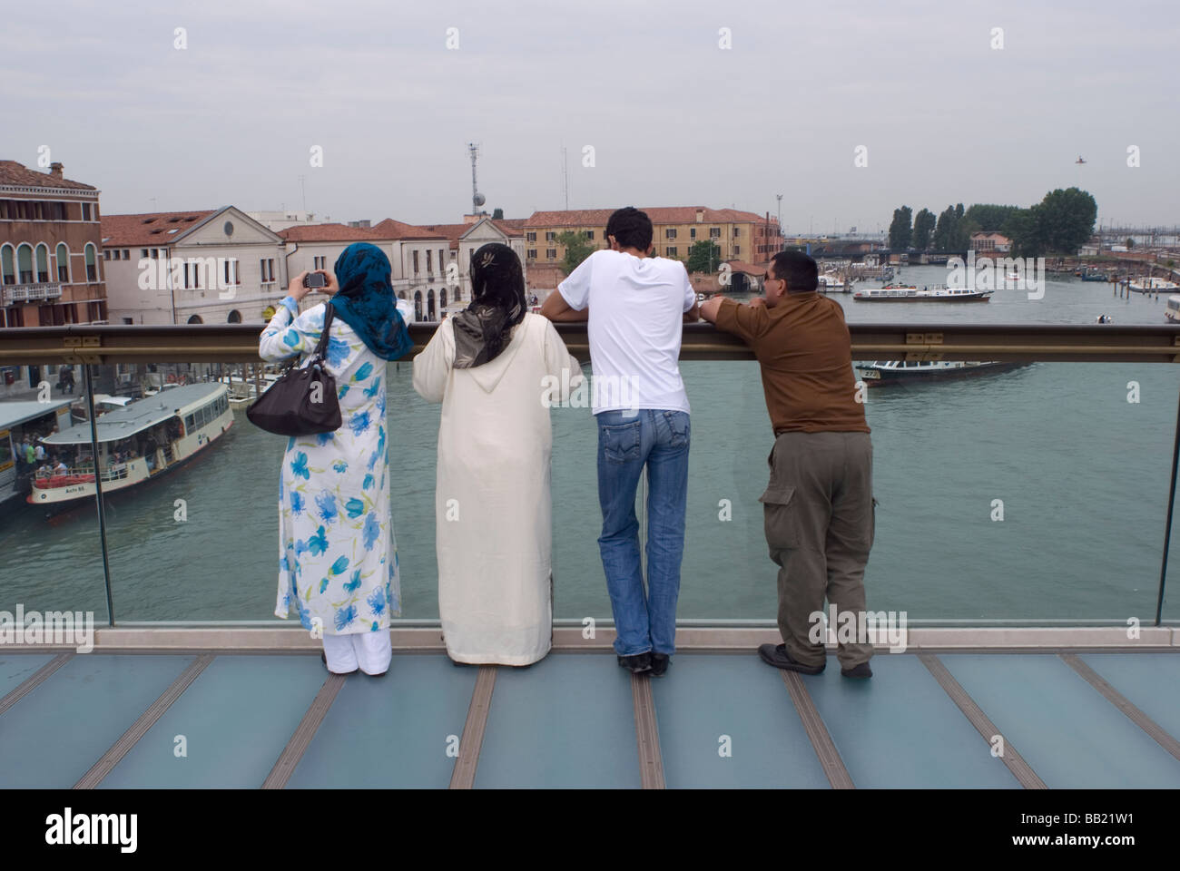 family of arab tourists on Calatrava Bridge Venice Italy Stock Photo ...