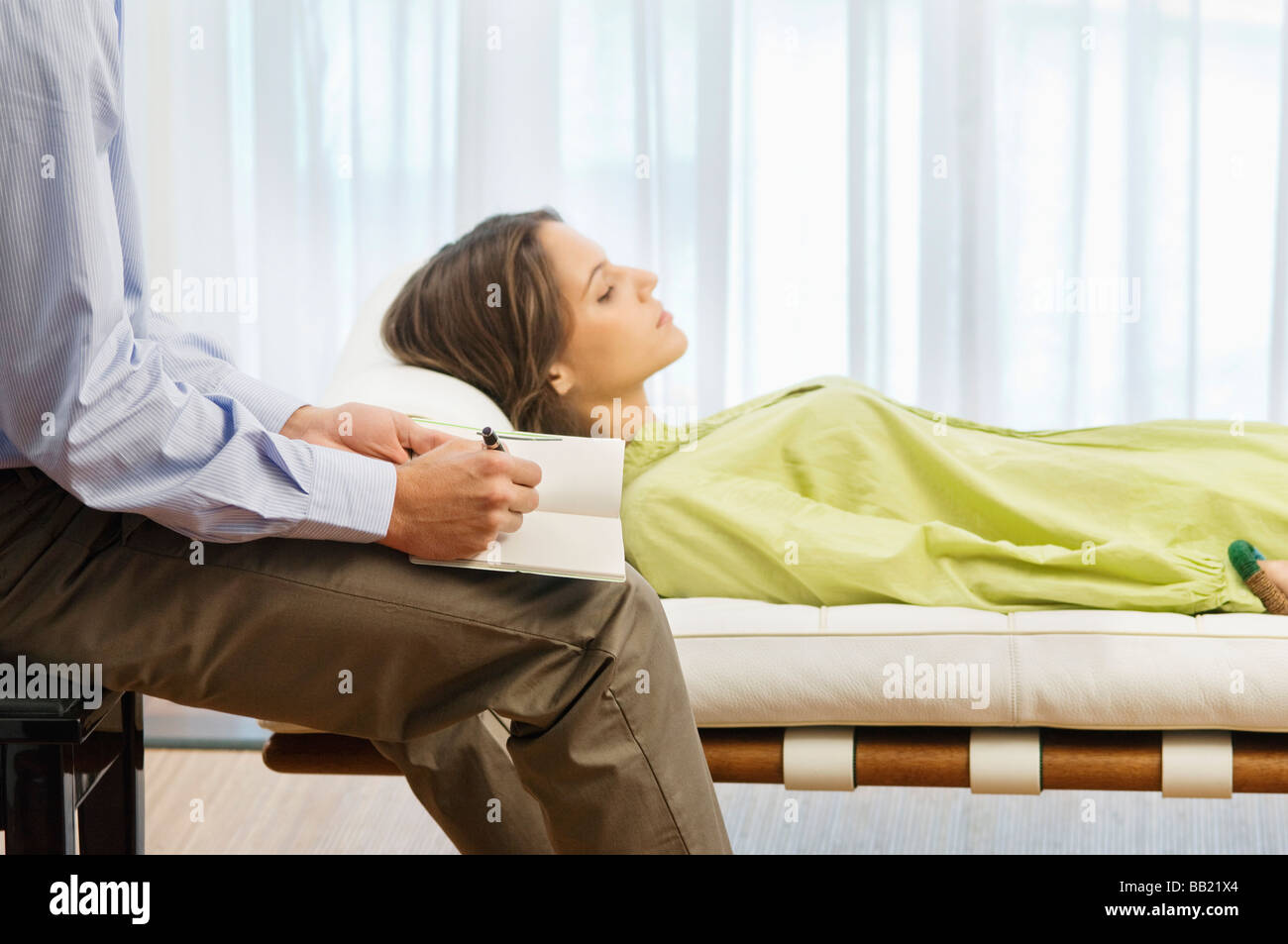 Psychiatrist examining a female patient Stock Photo - Alamy