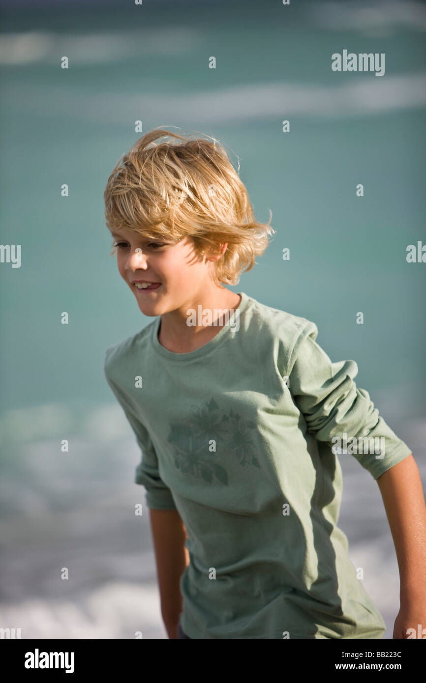 Boy smiling on the beach Stock Photo - Alamy