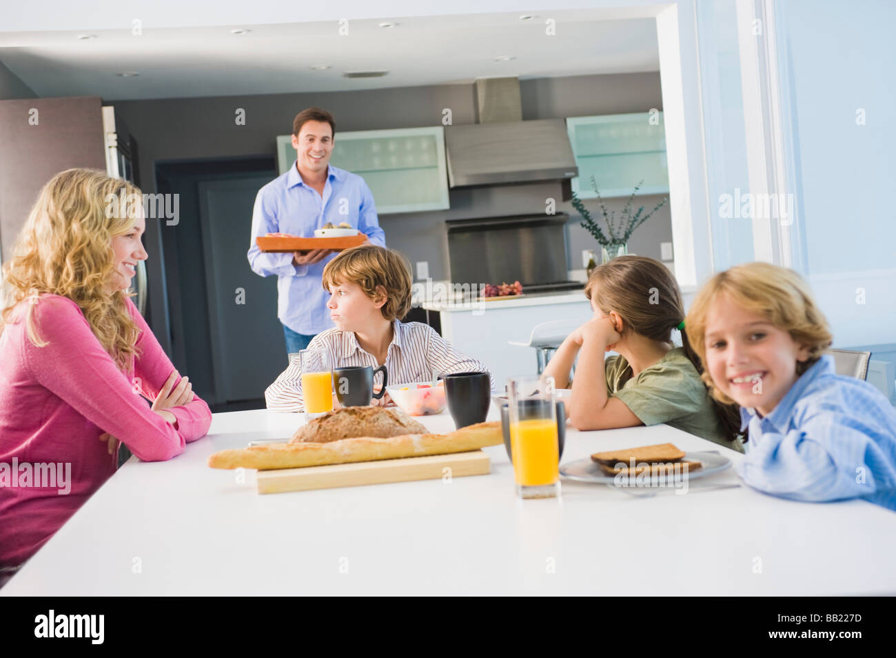 Family at the breakfast table Stock Photo - Alamy