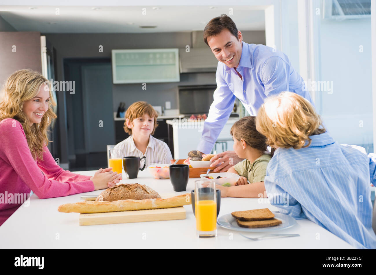 Family at the breakfast table Stock Photo - Alamy