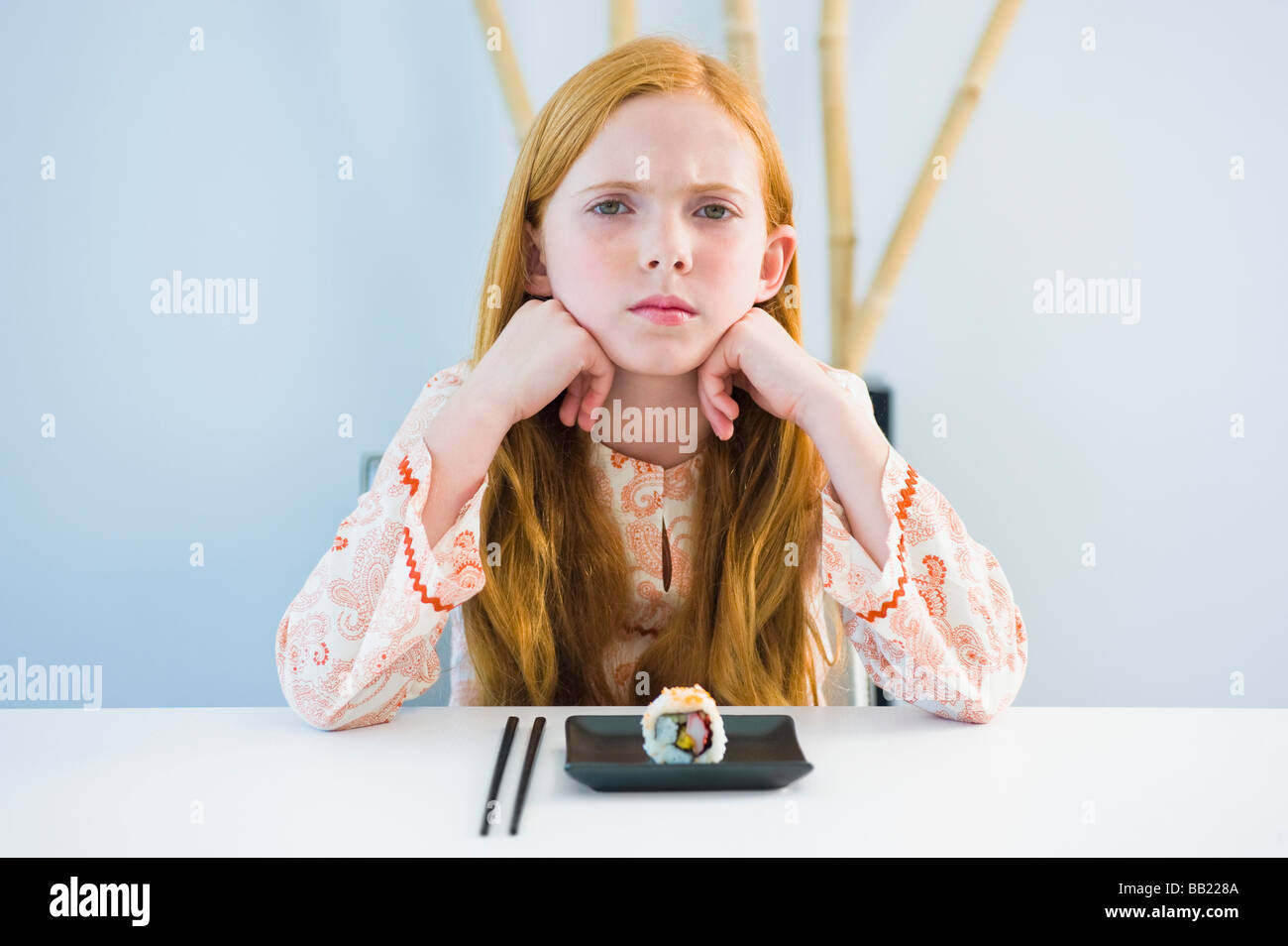 Portrait of a girl at the dining table Stock Photo - Alamy