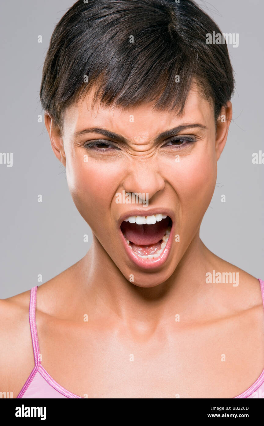 Portrait of a woman shouting Stock Photo - Alamy
