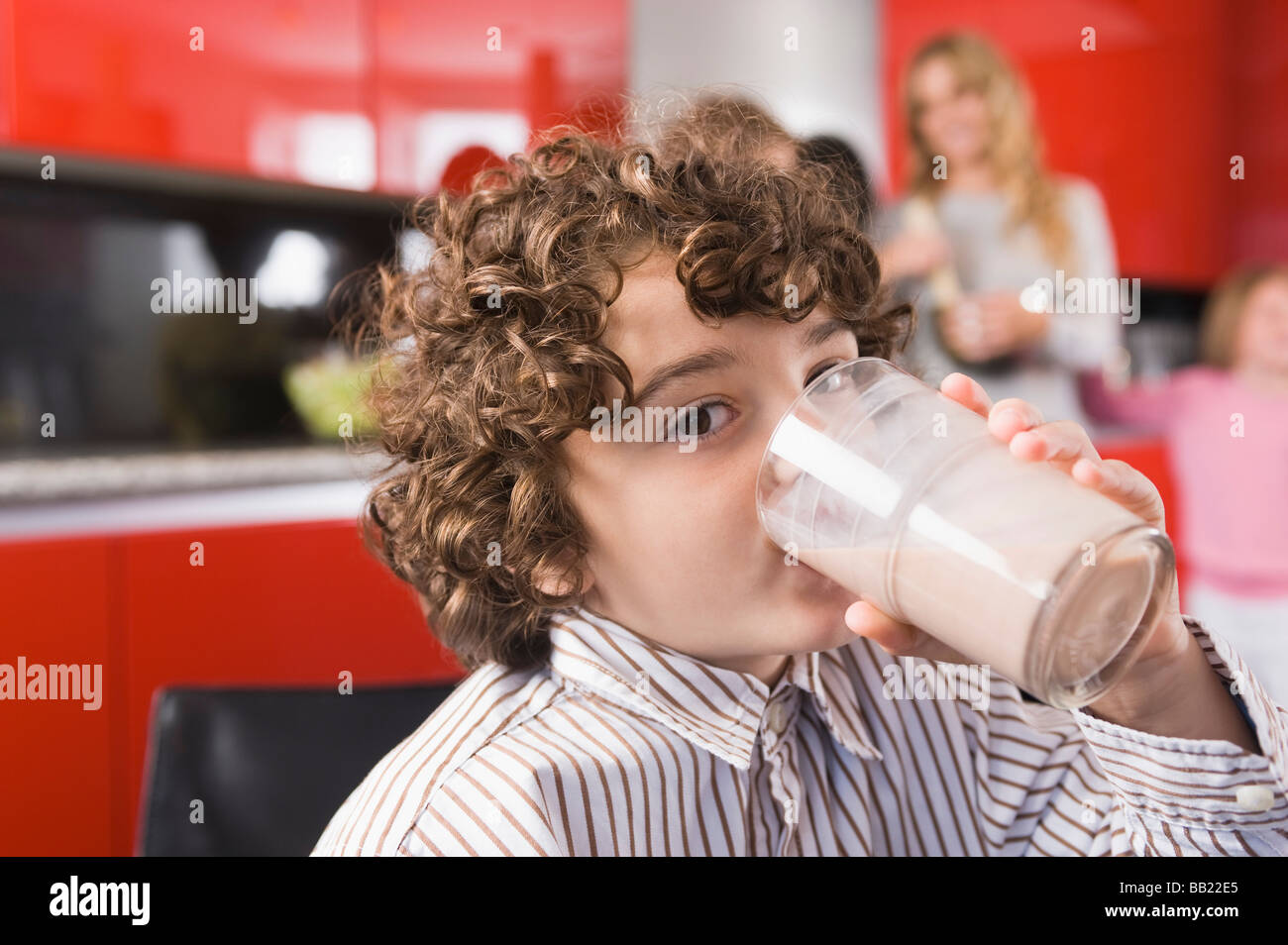 Portrait of a boy drinking a glass of milk Stock Photo - Alamy