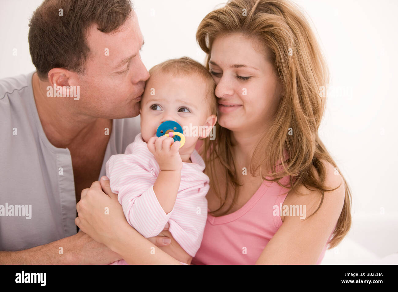 Parents loving their baby Stock Photo - Alamy