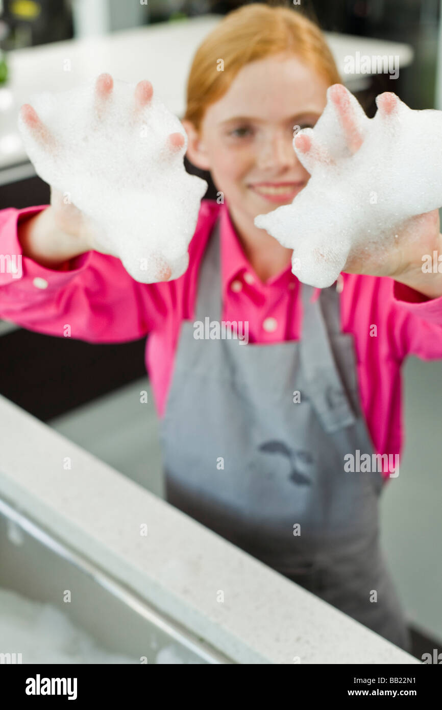 Portrait of a girl showing her hands covered in soap suds Stock Photo ...