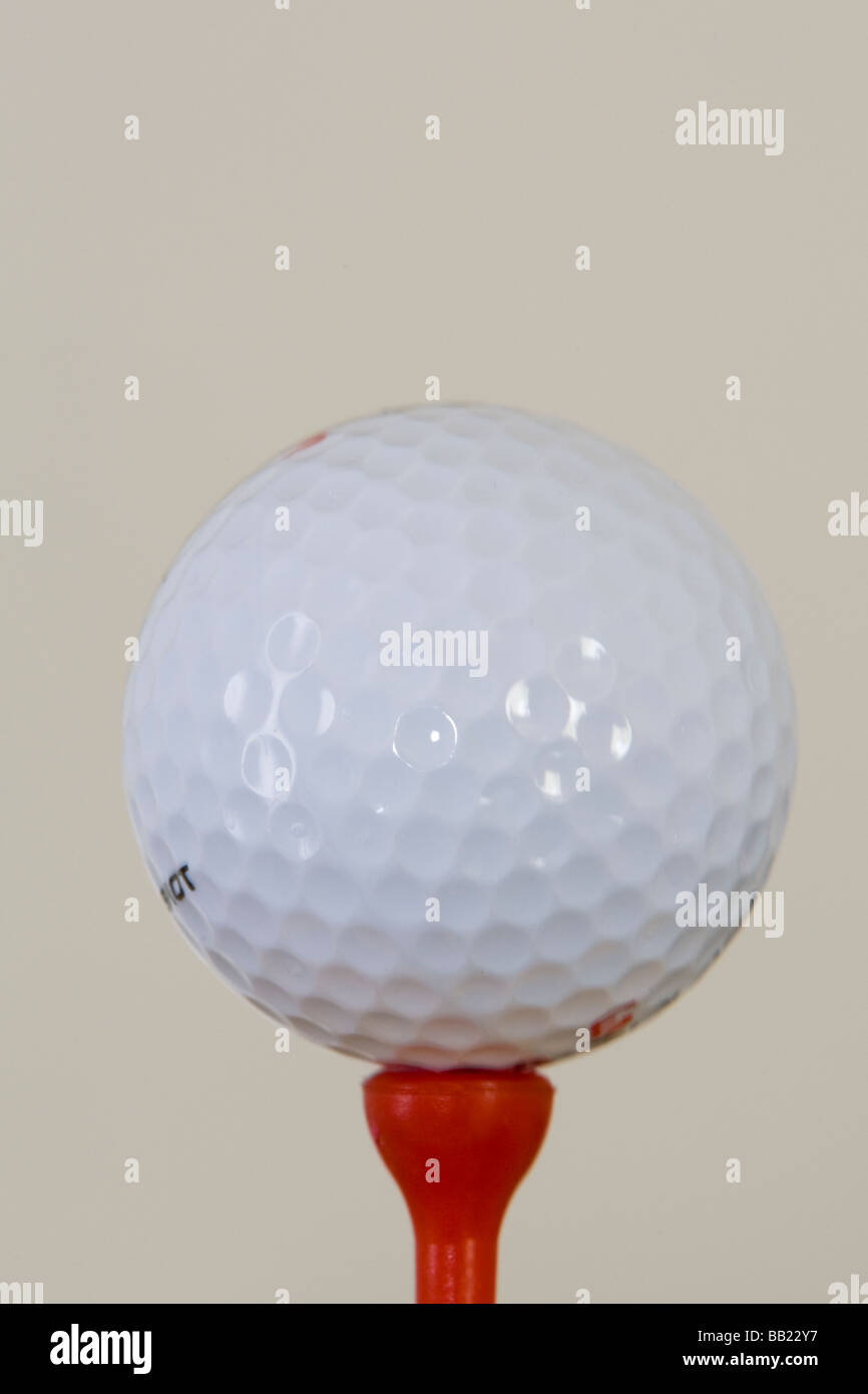 Golf ball balanced on tee hi-res stock photography and images - Alamy