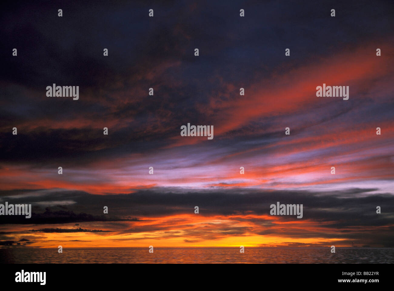 Sunset on ocean Stock Photo - Alamy