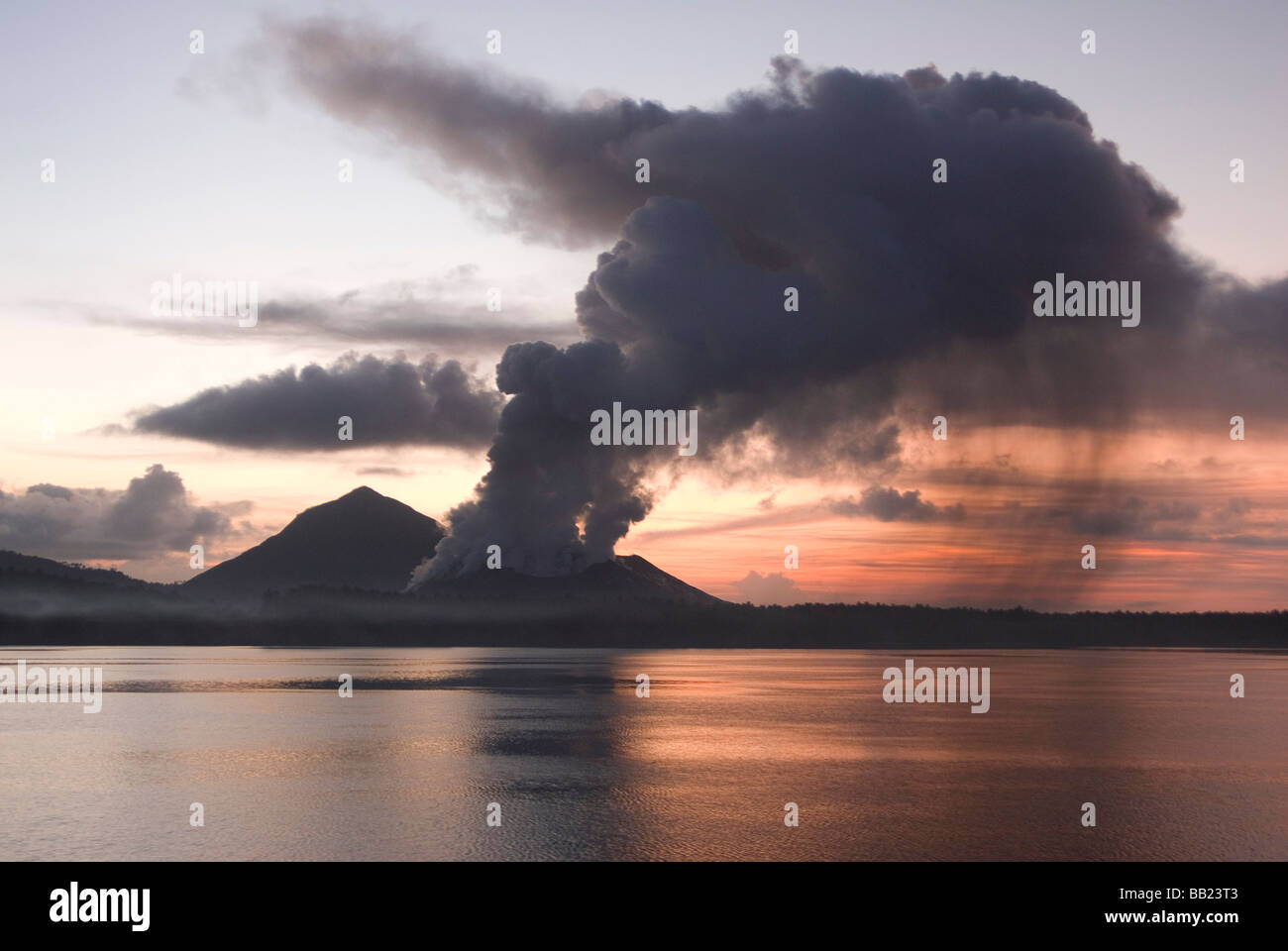 Papua New Guinea, New Britian Island, Rabaul Harbor. Smoke and ash are ...