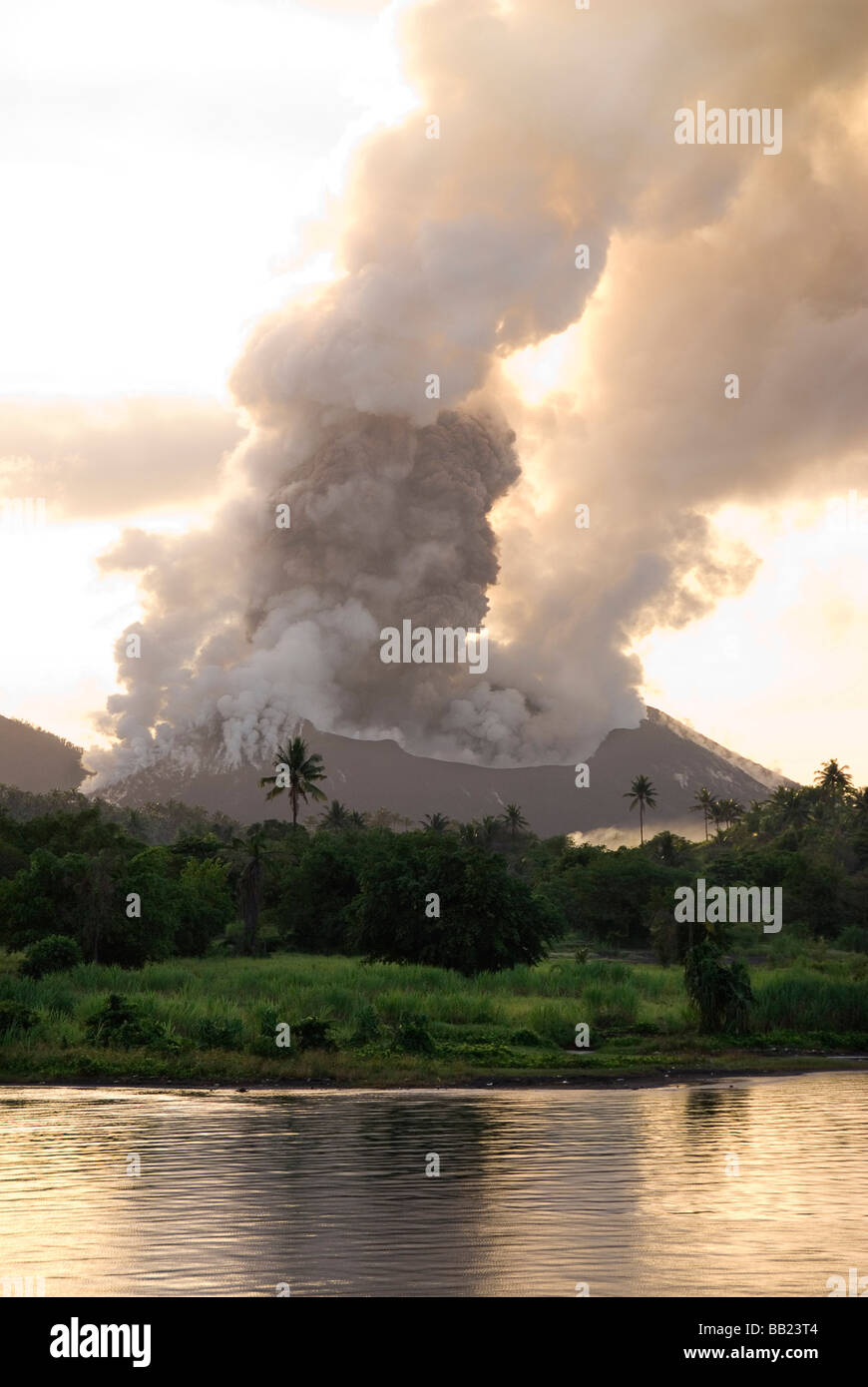 Papua New Guinea, New Britian Island, Rabaul Harbor. Smoke and ash are ...