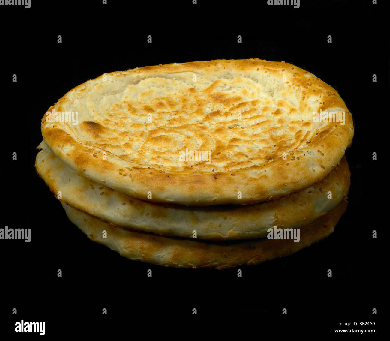 original fresh uzbek bread isolated over black background Stock Photo ...