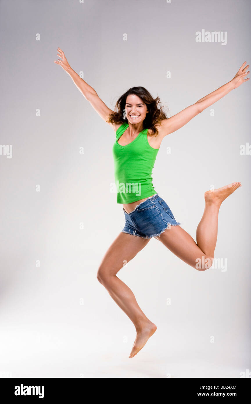 Woman jumping in excitement Stock Photo - Alamy