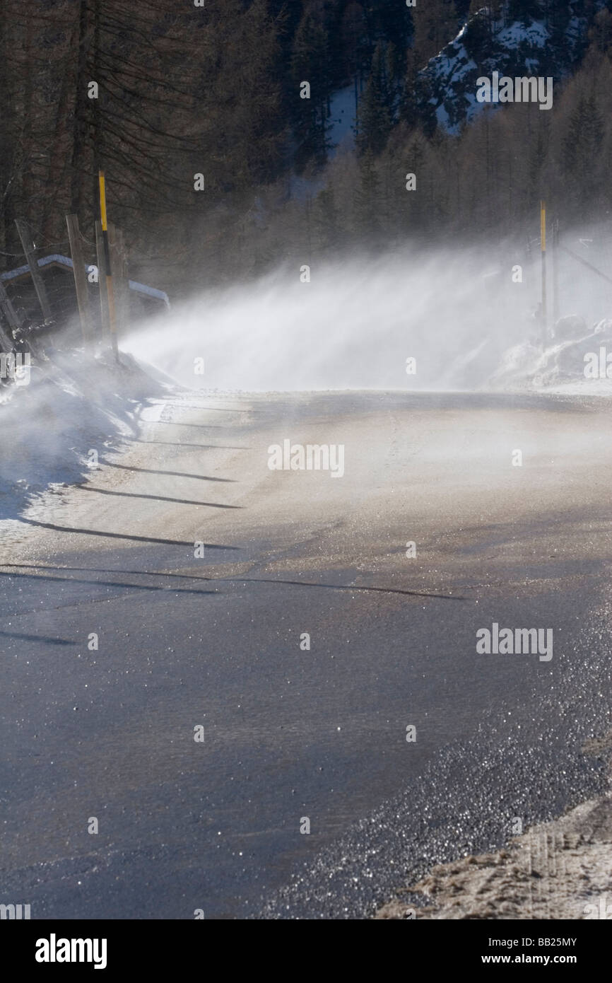 drifting snow across mountain road Stock Photo - Alamy