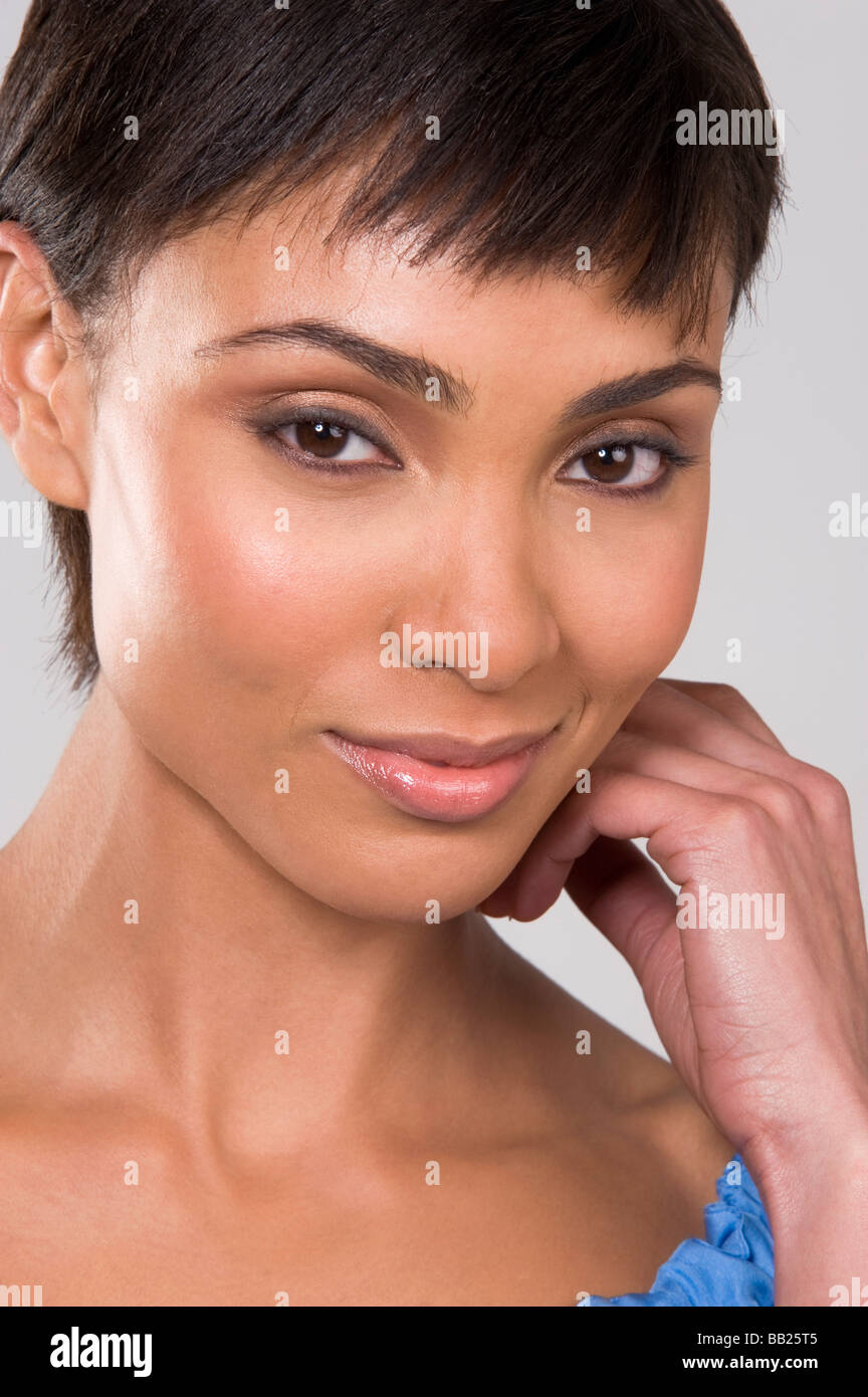 Portrait of a woman grinning Stock Photo - Alamy