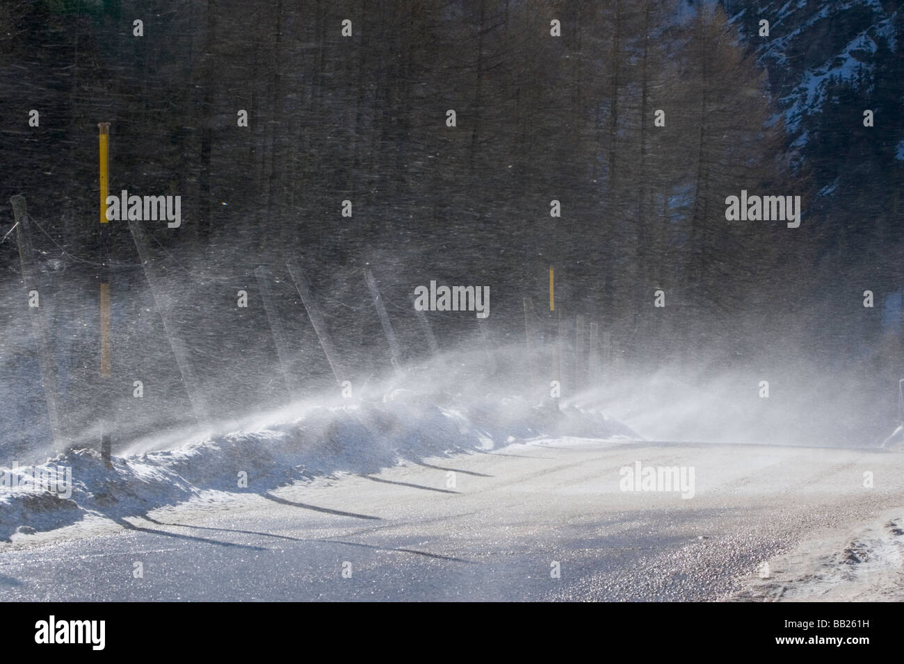 drifting snow across mountain road Stock Photo - Alamy