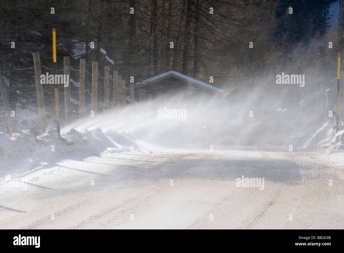 drifting snow across mountain road Stock Photo - Alamy