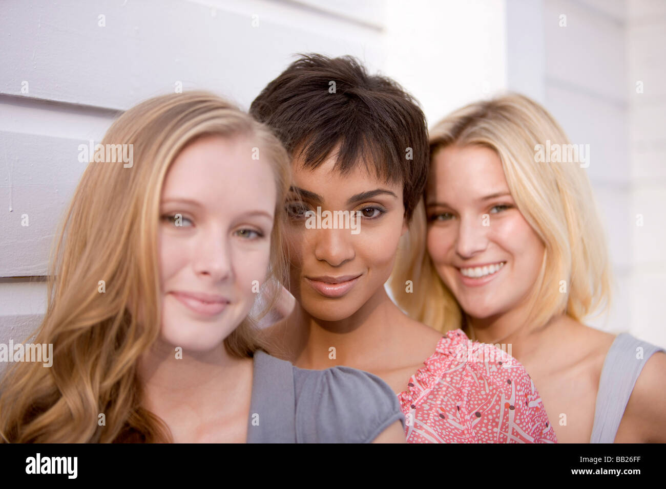 Portrait of three women smiling Stock Photo - Alamy