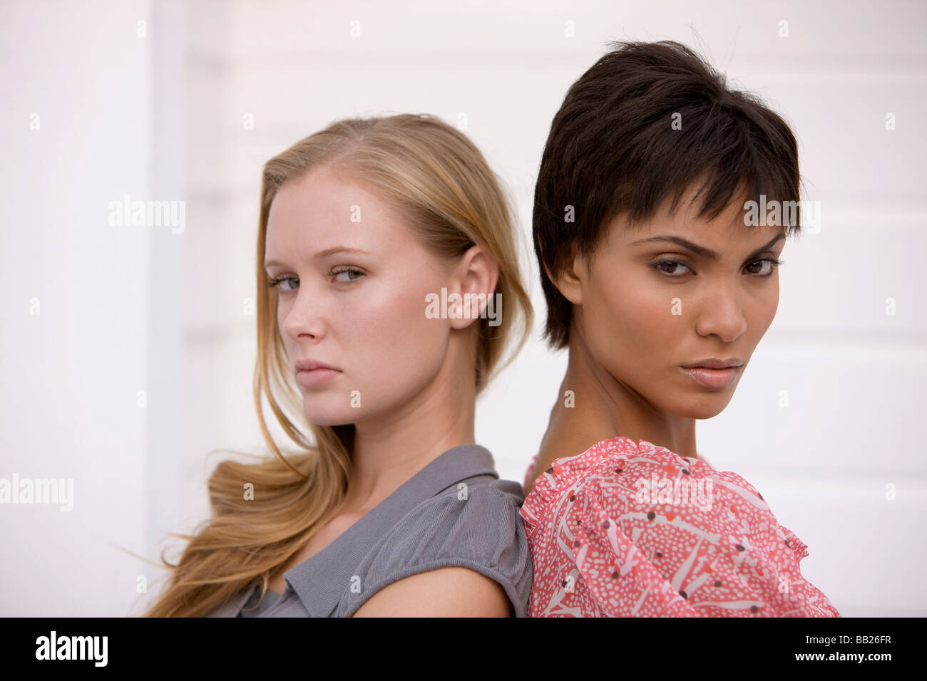 Two women looking serious Stock Photo - Alamy