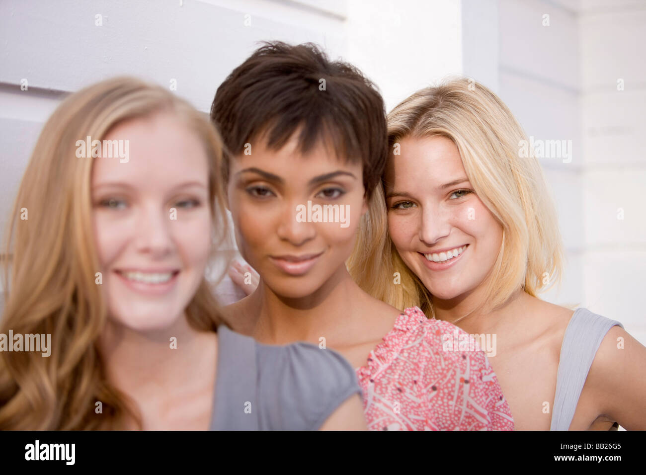 Portrait of three women smiling Stock Photo - Alamy
