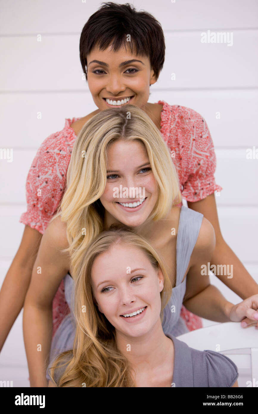 Portrait of three women smiling Stock Photo - Alamy