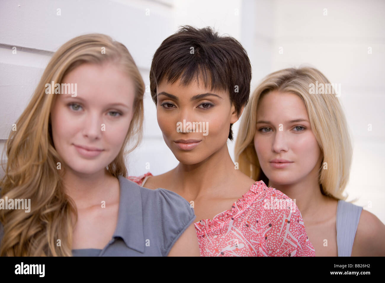 Portrait of three women posing Stock Photo - Alamy