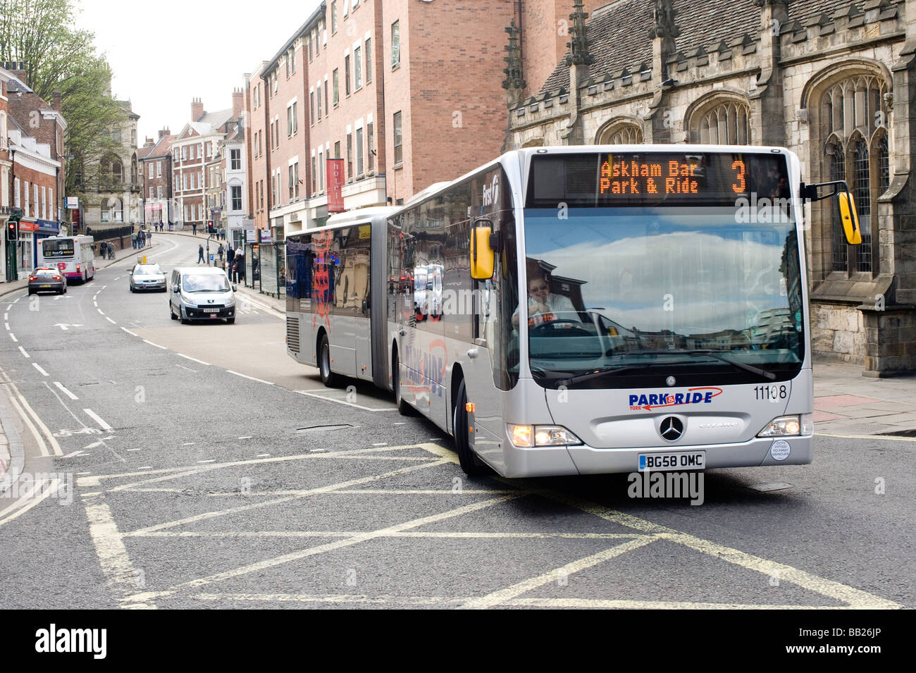 Silver bendy bus on a park and ride service in York city centre England ...
